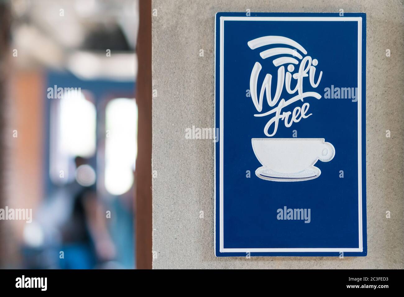 Free wifi word on wall in front of coffee shop background Stock Photo ...