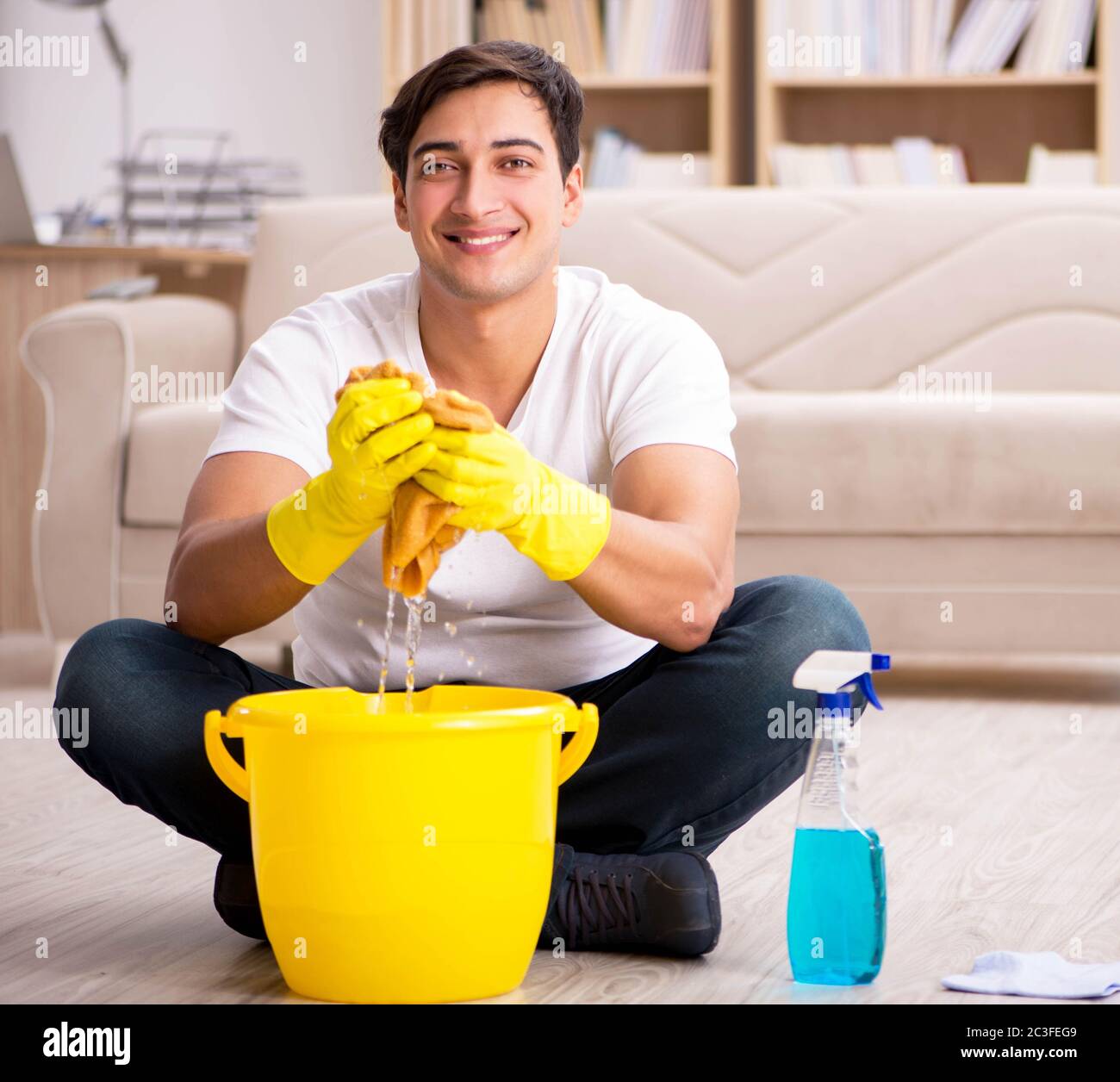 Man husband cleaning the house helping wife Stock Photo - Alamy