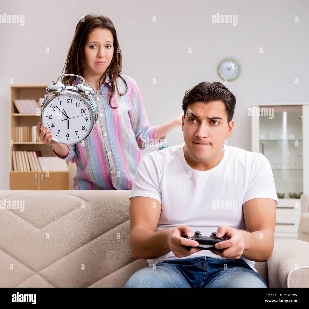 Young family suffering from computer games addiction Stock Photo - Alamy