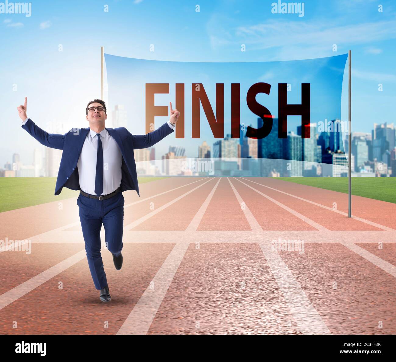 Businessman on the finishing line in competition concept Stock Photo ...