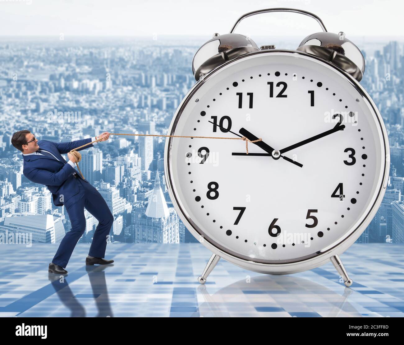 Businessman pulling clock in time management concept Stock Photo - Alamy