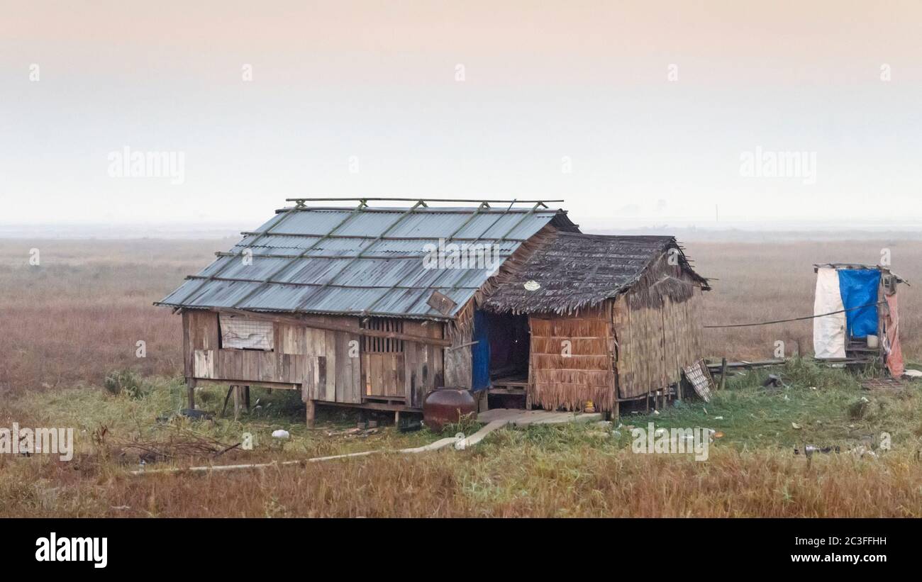 Poor hut in the morning fog. Myanmar Burma Stock Photo - Alamy