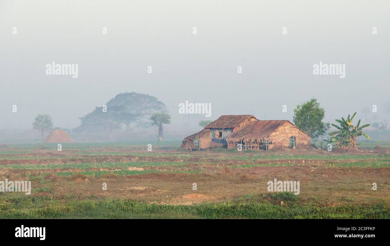 Poor shack in the morning fog. Myanmar Burma Stock Photo - Alamy