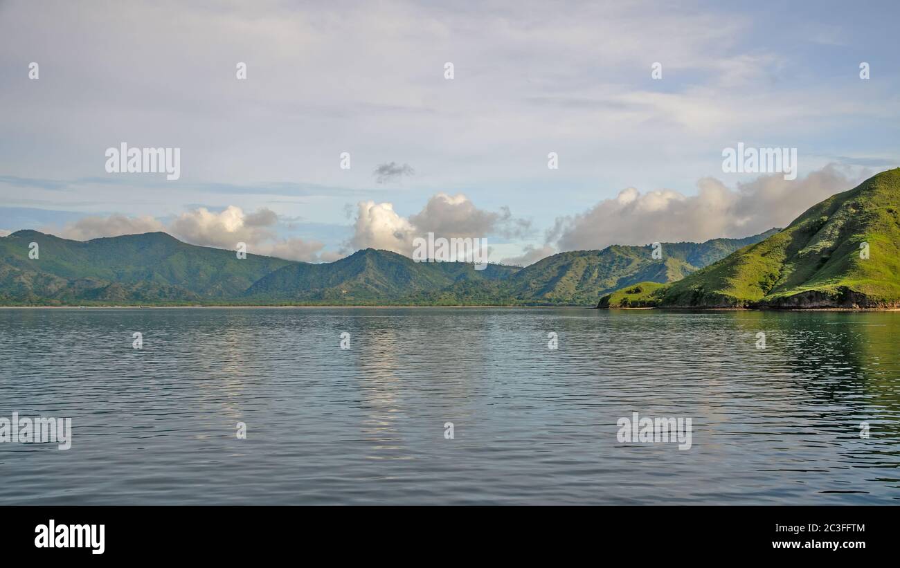 Green hills with thick green tropical vegetation. Lesser Sunda Islands ...