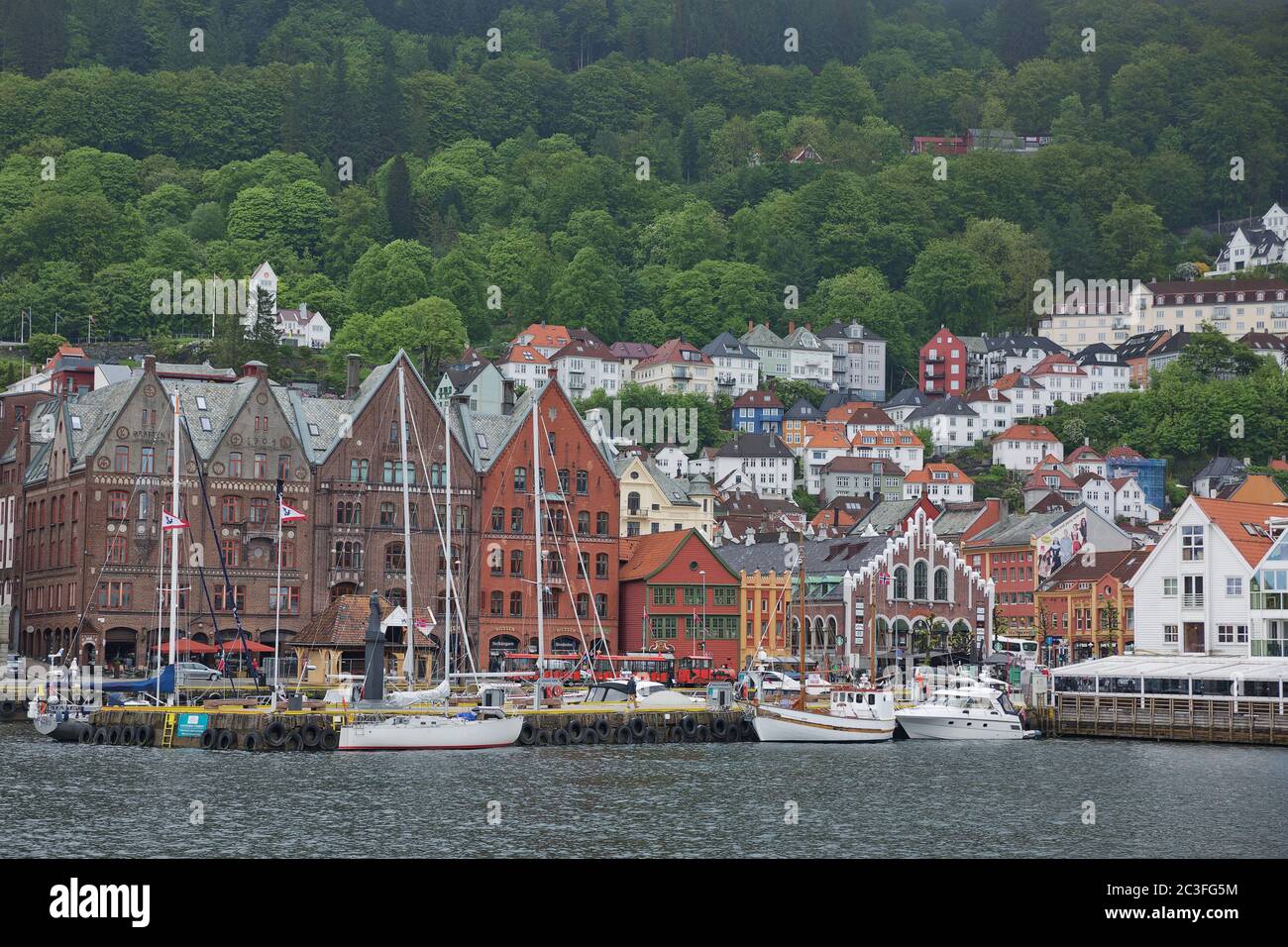 Old hansaetic wooden houses built in row at wharf of Bergen fjord are ...