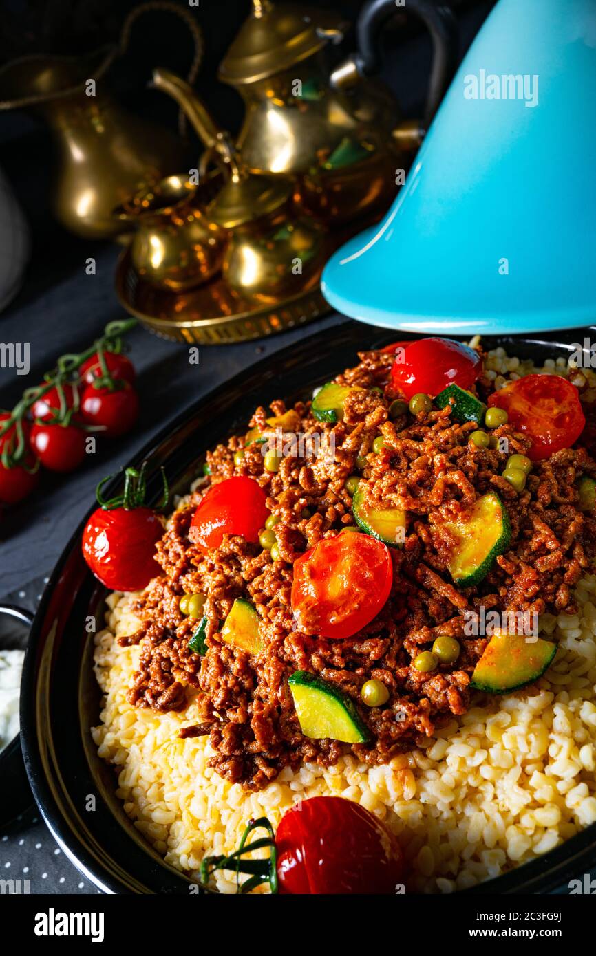Tomato bulgur with vegetables and minced meat Stock Photo - Alamy