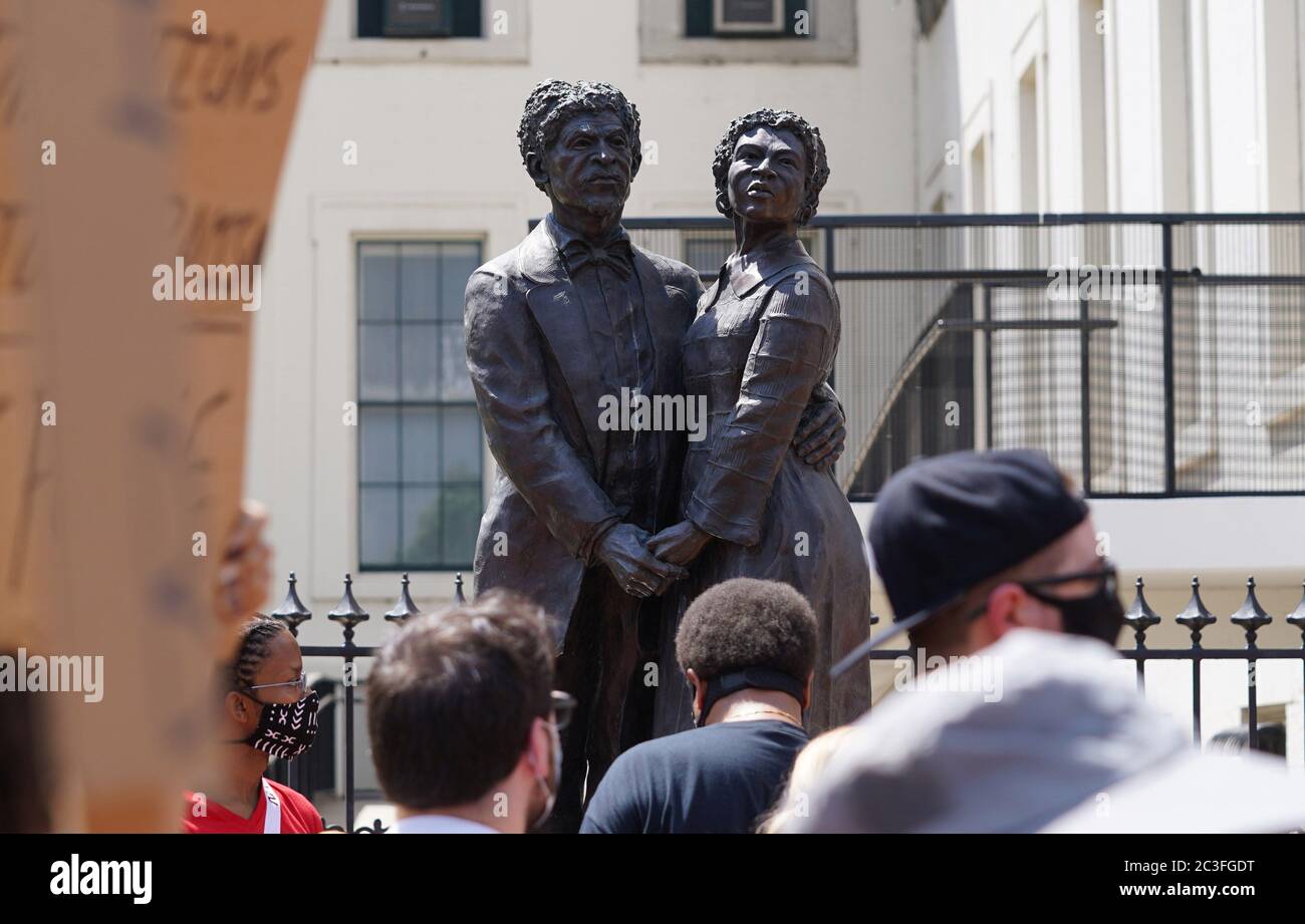St. Louis, United States. 19th June, 2020. Marchers walk past the ...