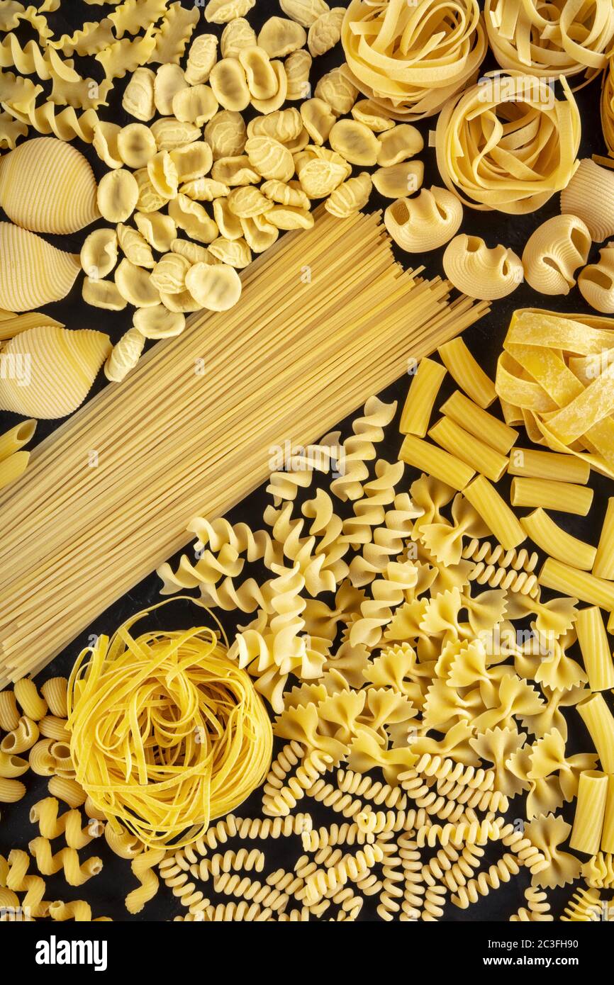 Italian pasta background texture, a flatlay of various types, overhead ...