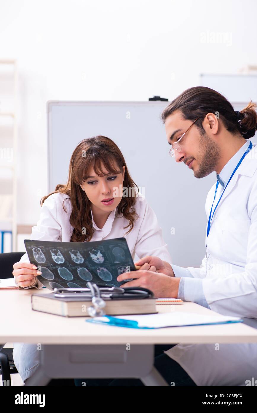 Young male doctor radiologist and female student in the classroo Stock ...