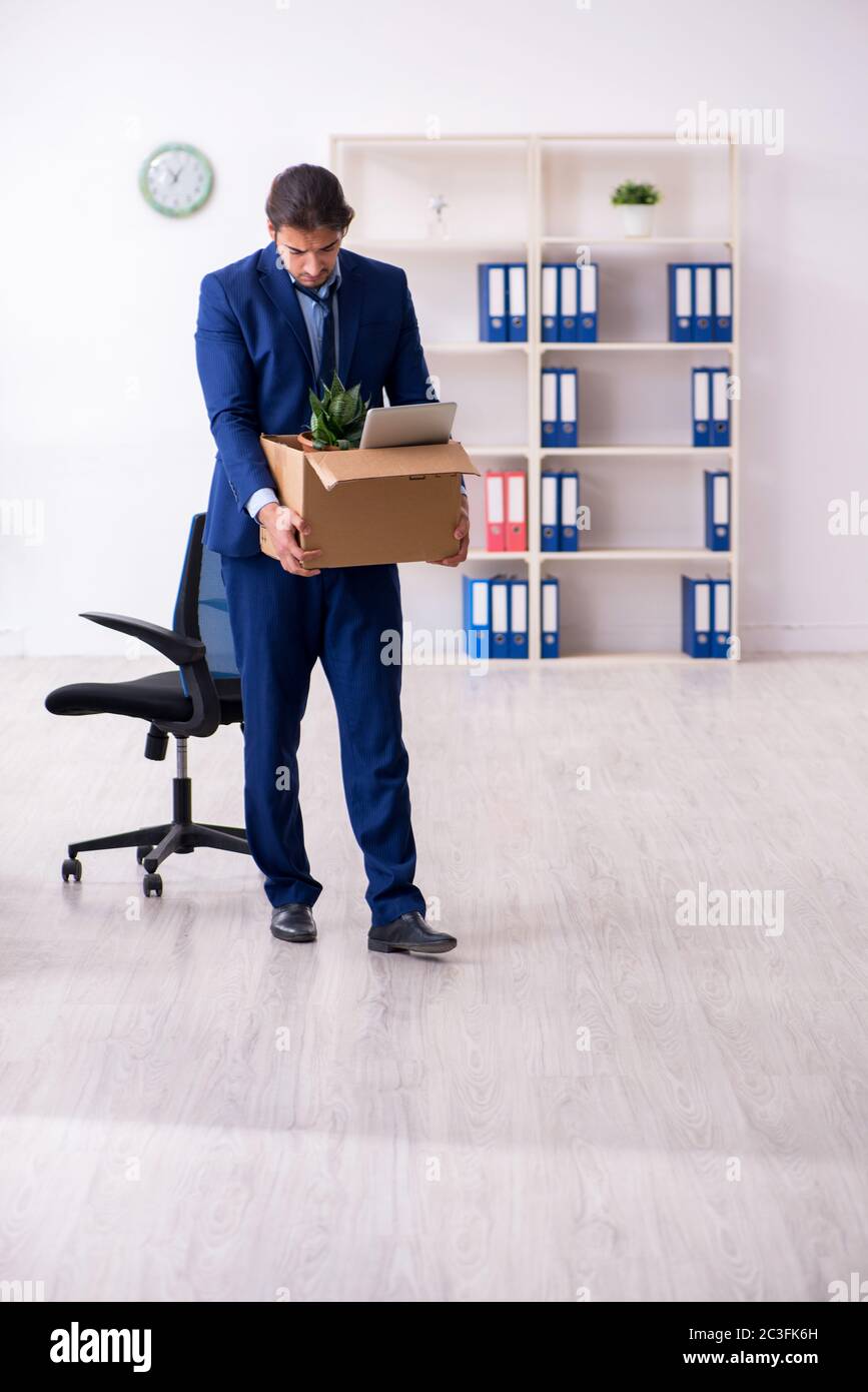 Young man being fired from his work Stock Photo - Alamy