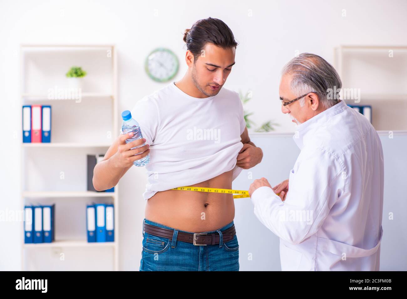 Doctor dietician giving advices to fat overweight patient Stock Photo ...