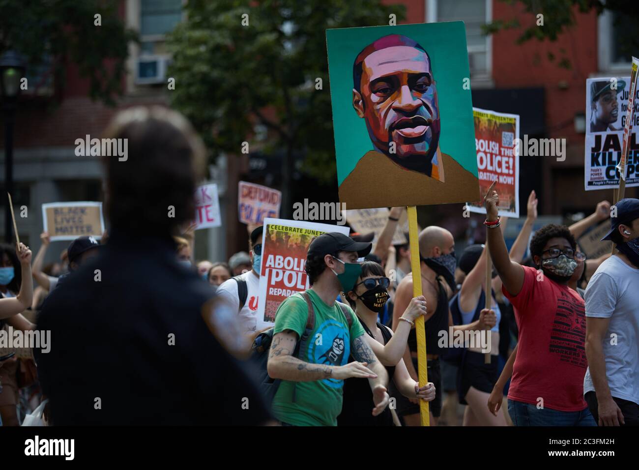 Manhattan, New York, U.S.A. 19th June, 2020. A woman protesting carries ...