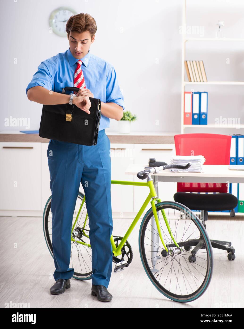 Urban businessman bicycle checking hi-res stock photography and images ...
