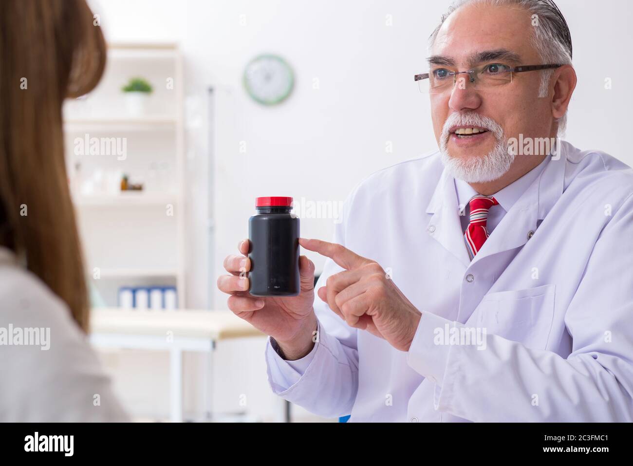 Doctor showing prescription patient discussing hi-res stock photography ...
