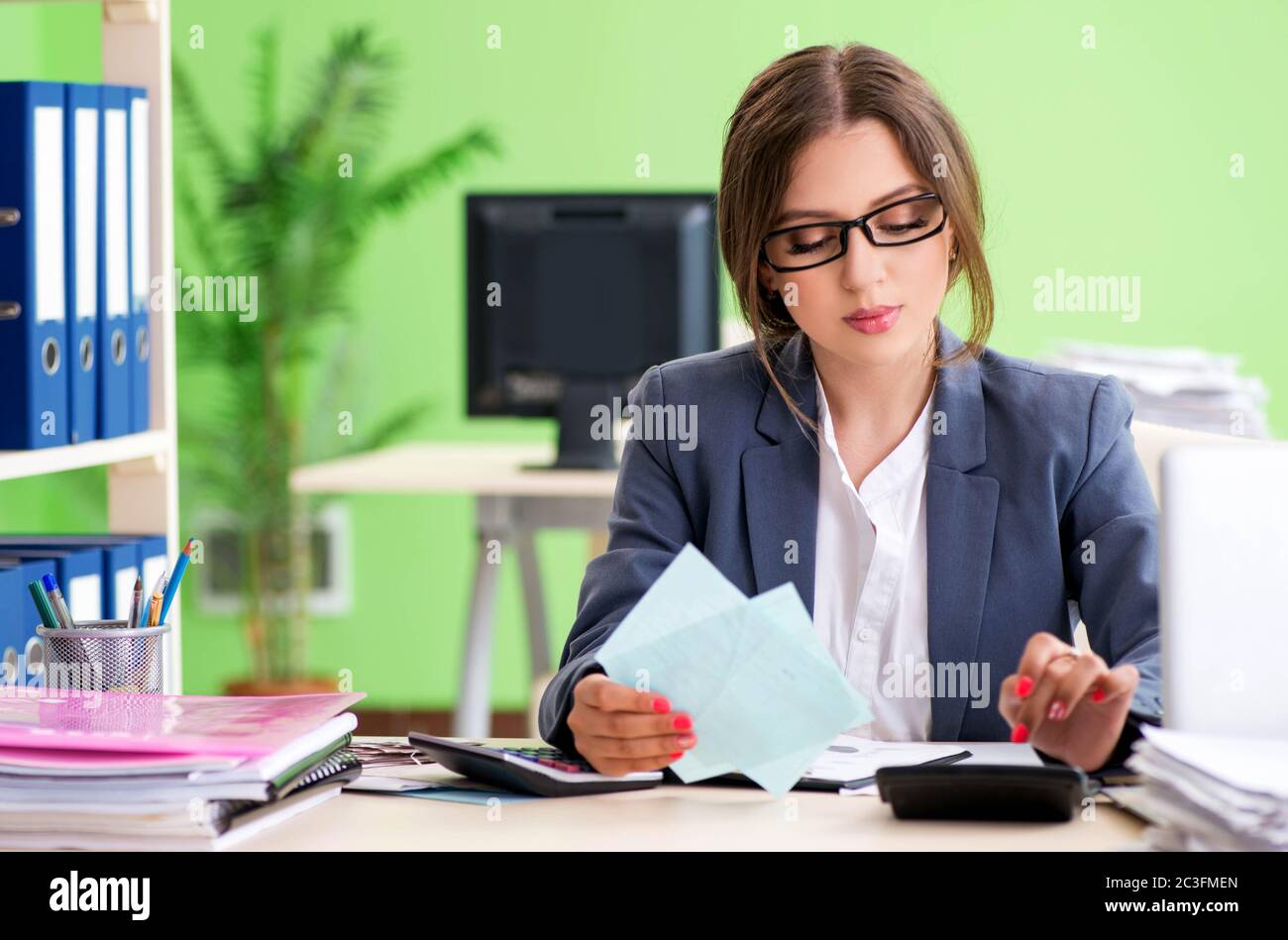 Female financial manager working in the office Stock Photo - Alamy