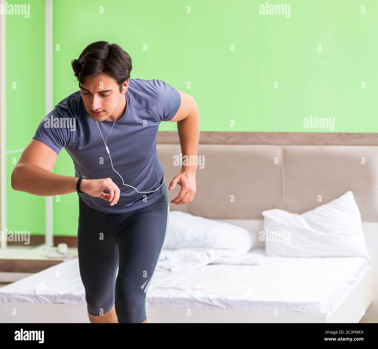 Sporty man running in place hi-res stock photography and images - Alamy