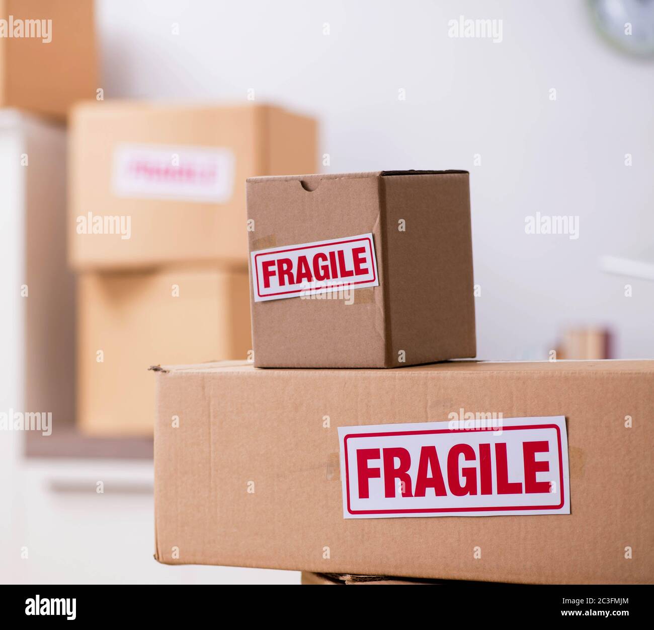 Man moving house and relocating with fragile items Stock Photo - Alamy