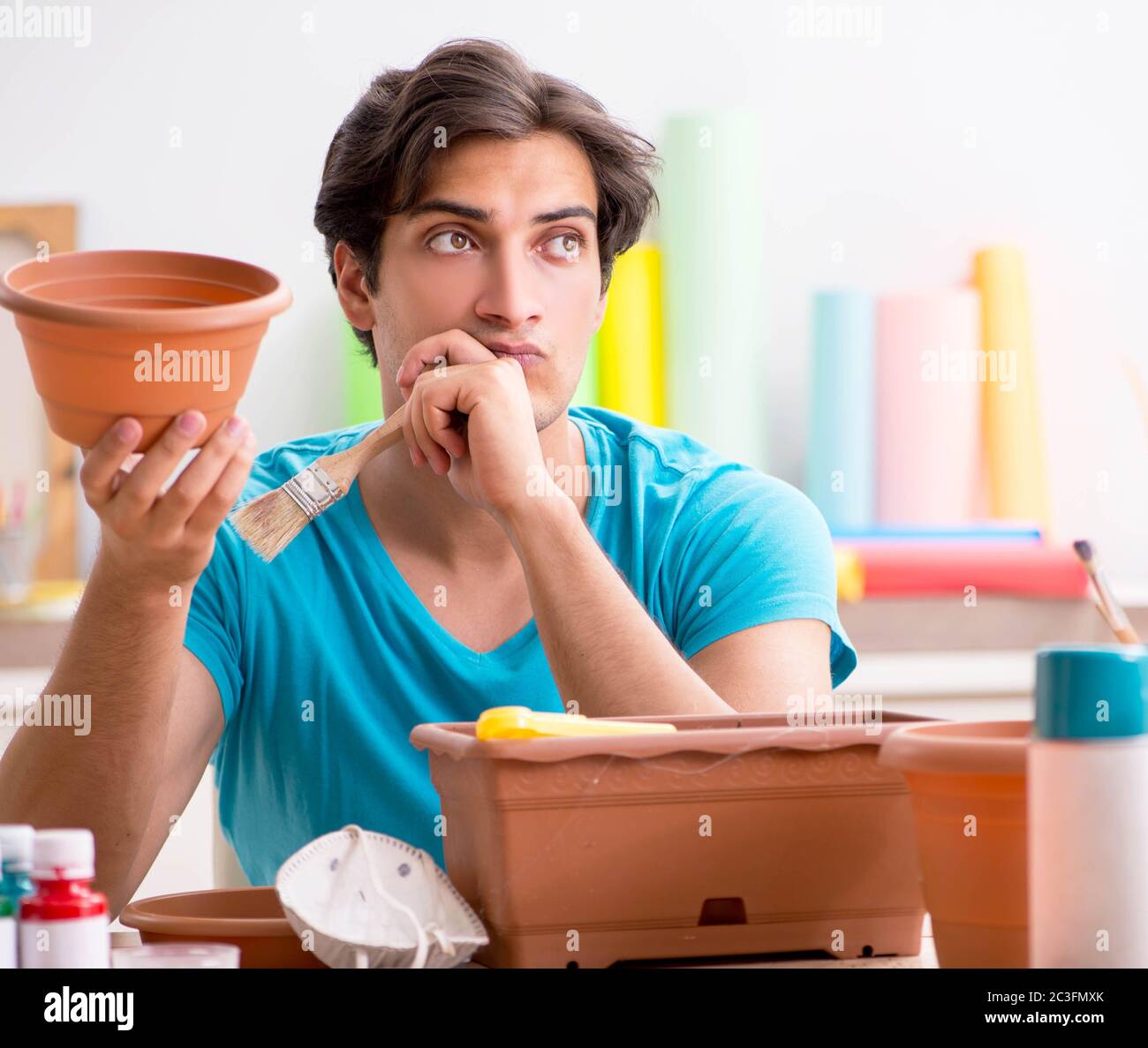 Man decorating pottery hi-res stock photography and images - Alamy