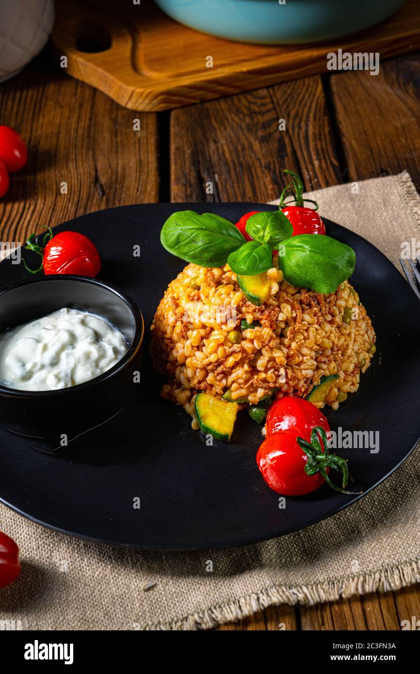 rustic bulgur fried with minced meat and vegetables Stock Photo - Alamy