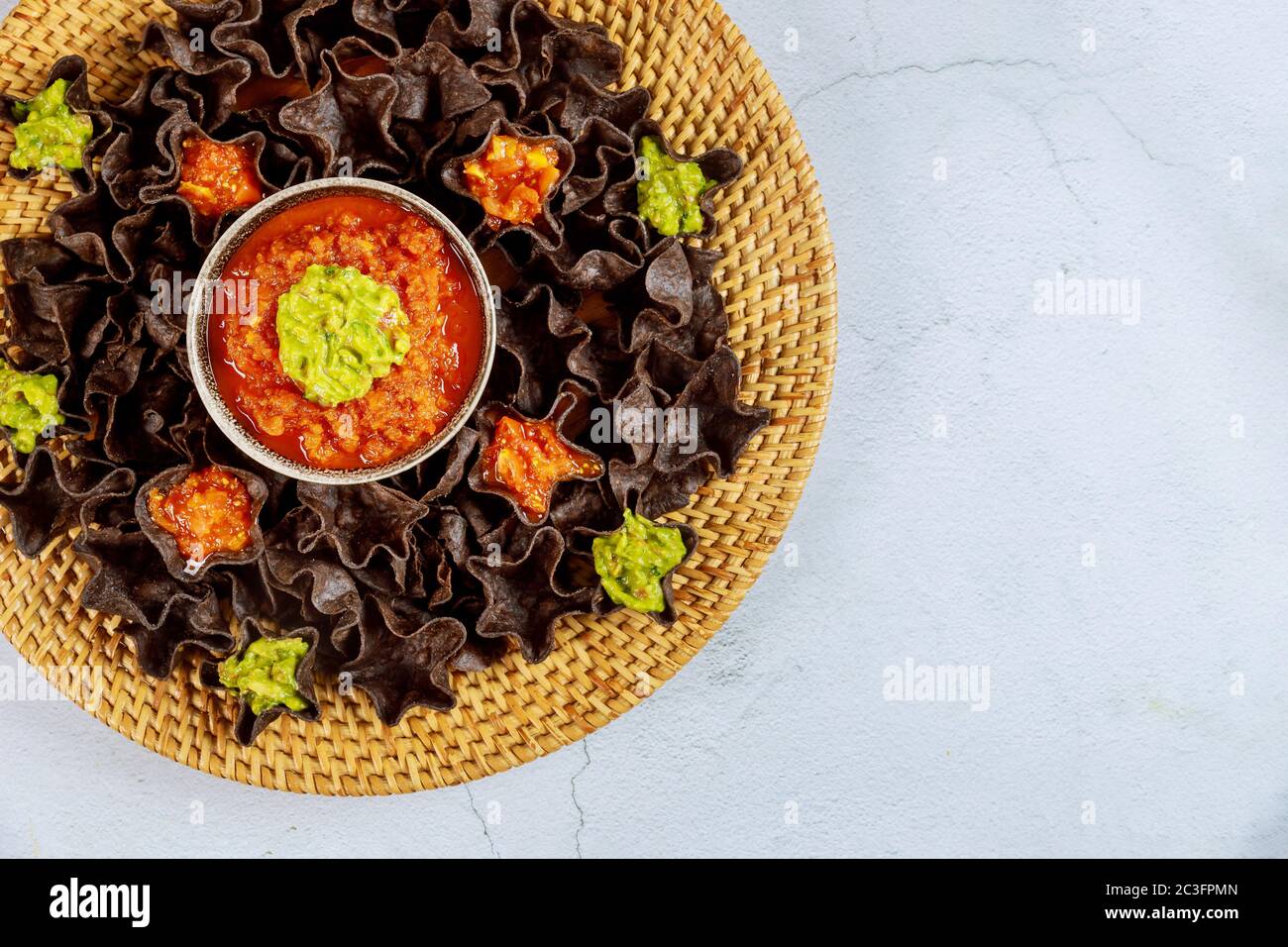Blue corn tortilla chips with salsa and guacamole. Close up. Mexican ...