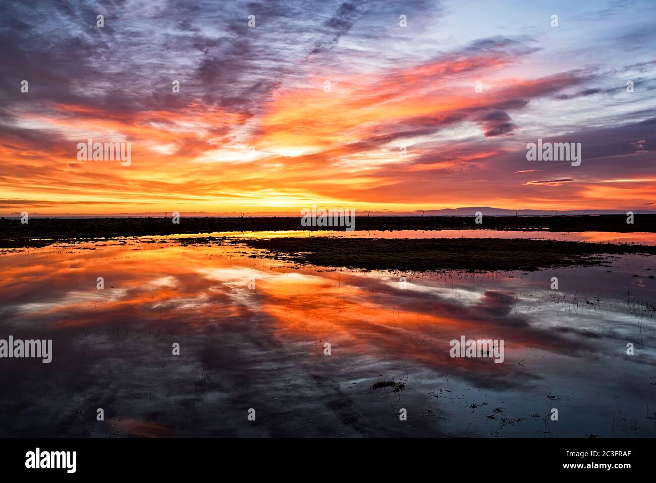 Bright sunset sky reflected in hi-res stock photography and images - Alamy