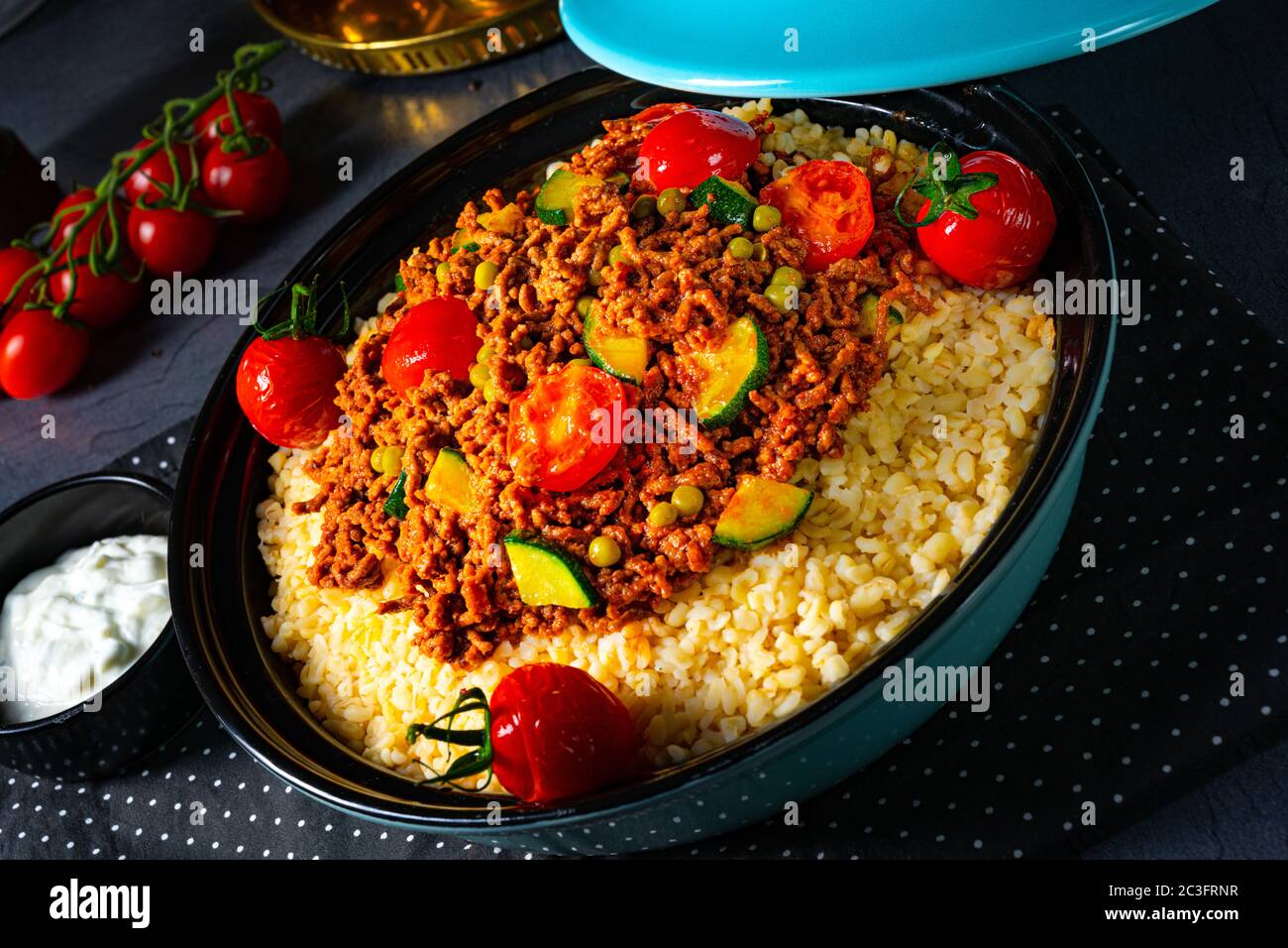 Tomato bulgur with vegetables and minced meat Stock Photo - Alamy