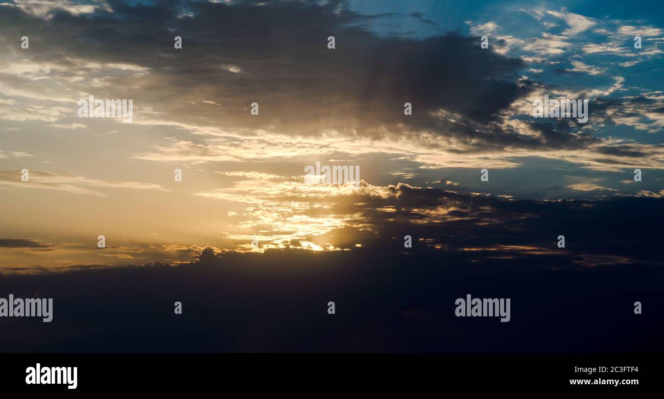 sky with clouds and rays of the setting sun Stock Photo - Alamy
