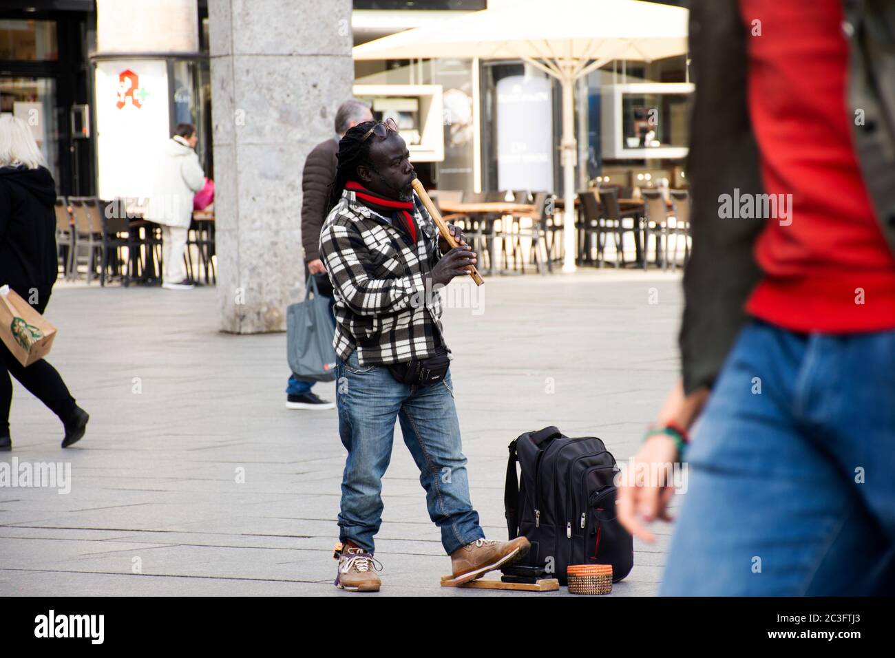 African American Gypsy playing flute music for show German people and ...