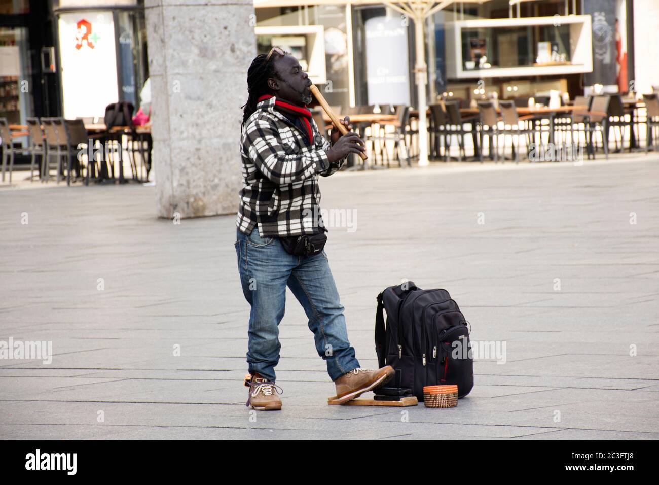African American Gypsy playing flute music for show German people and ...