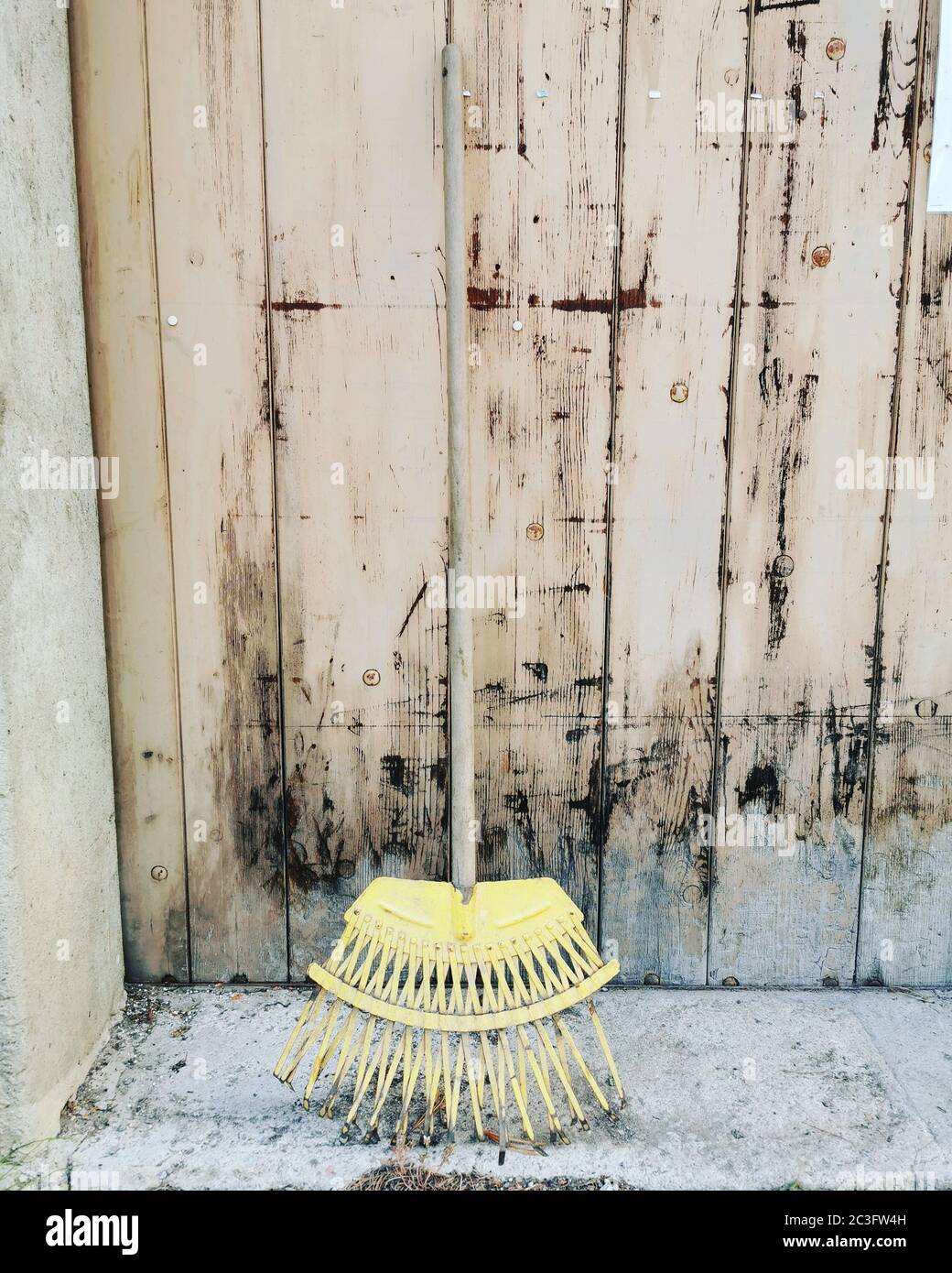 Yellow rake hi-res stock photography and images - Alamy