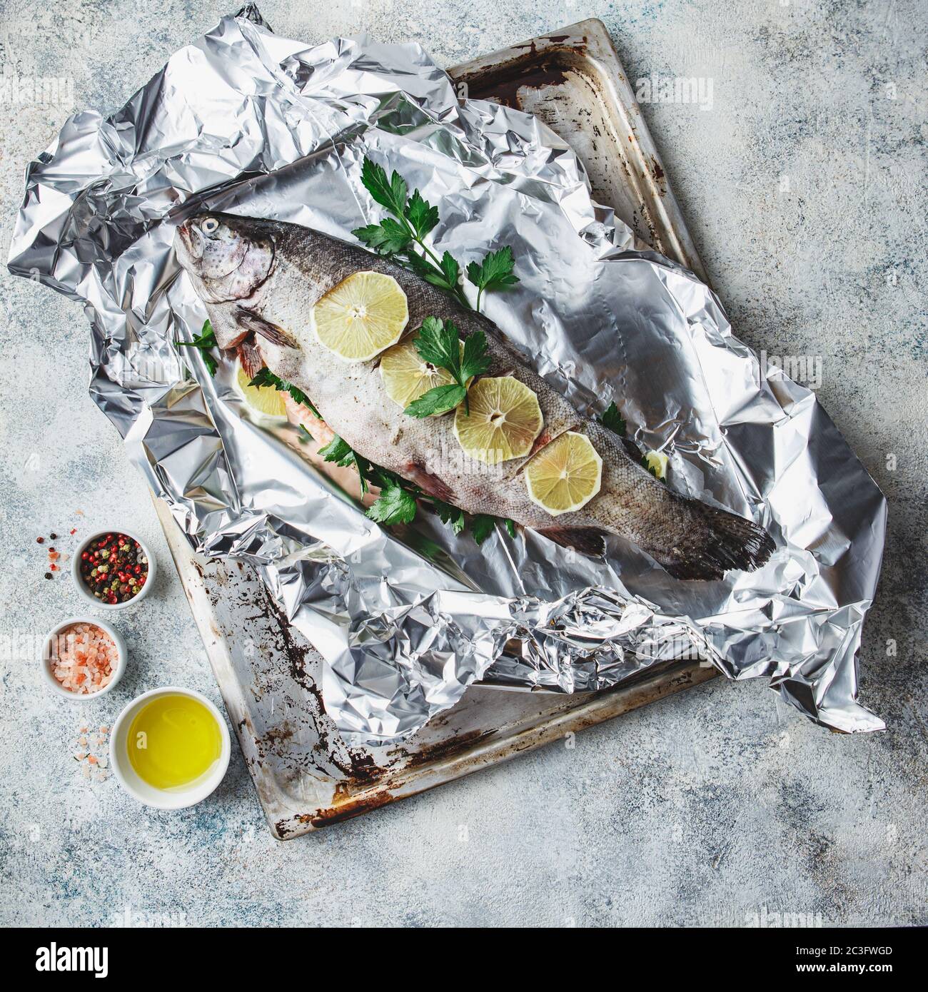 Raw rainbow trout in foil Stock Photo - Alamy