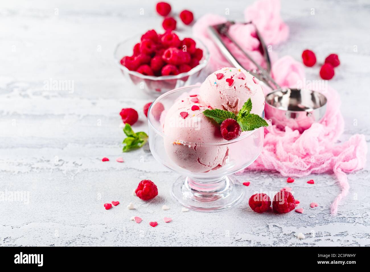 Raspberry ice cream in bowl Stock Photo - Alamy