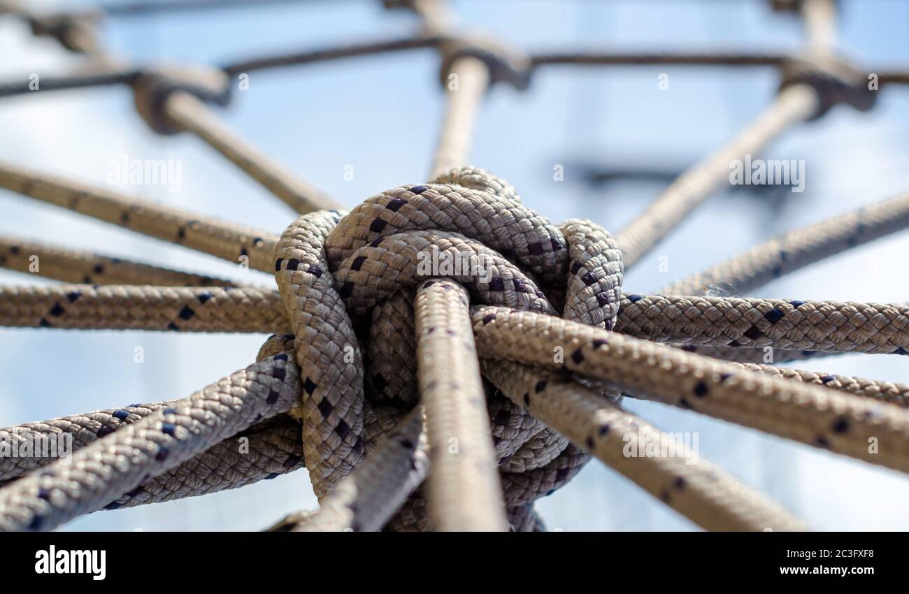 many ropes and one big knot close up Stock Photo - Alamy
