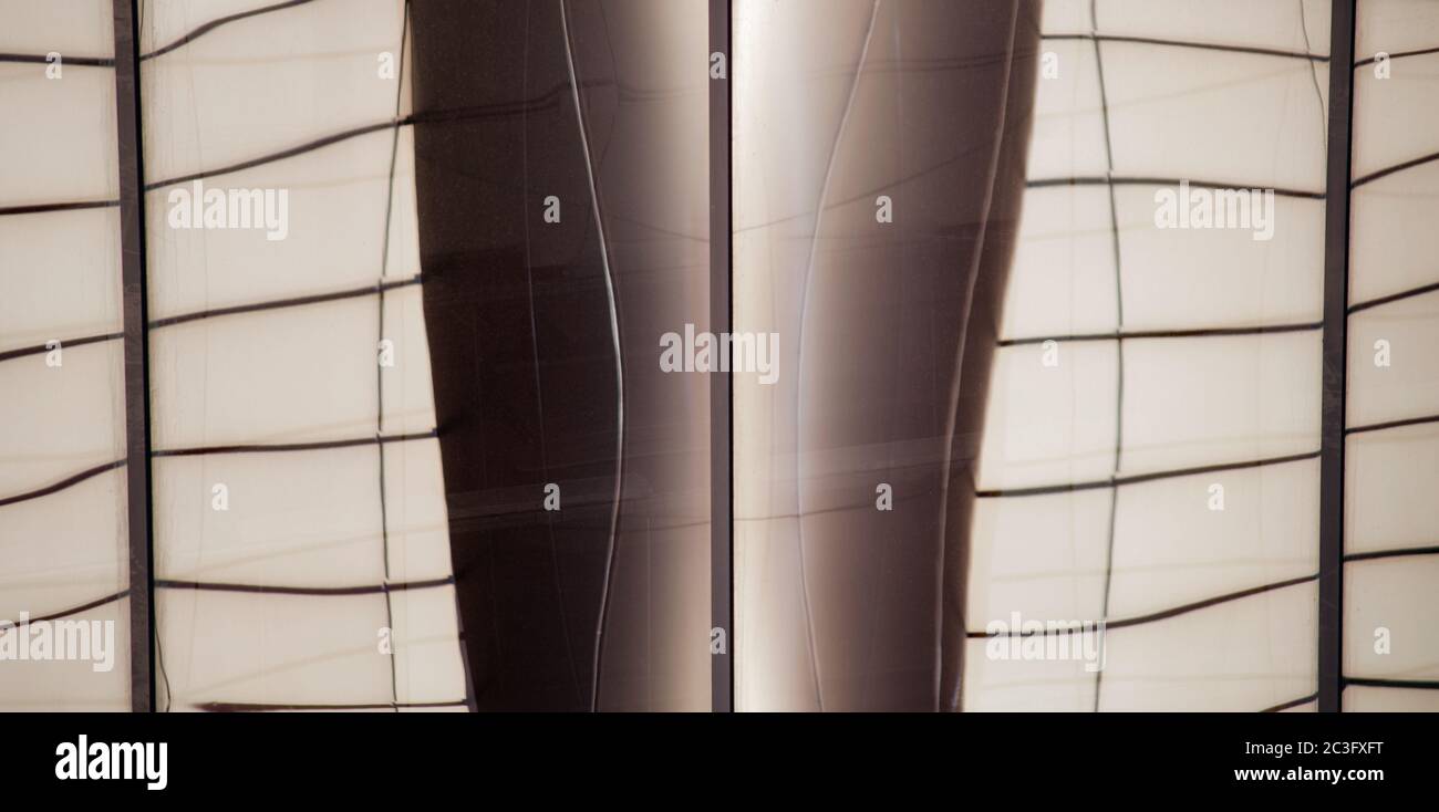reflection with distortion in the window of a modern building Stock ...