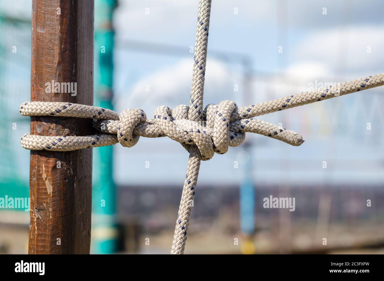 many ropes and one big knot close up Stock Photo - Alamy