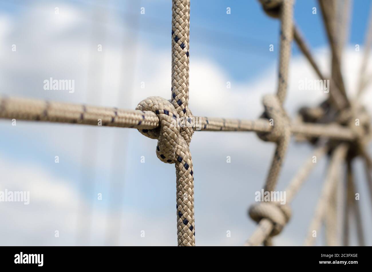 many ropes and one big knot close up Stock Photo - Alamy