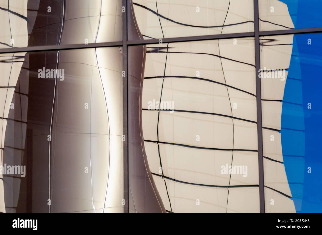 reflection with distortion in the window of a modern building Stock ...