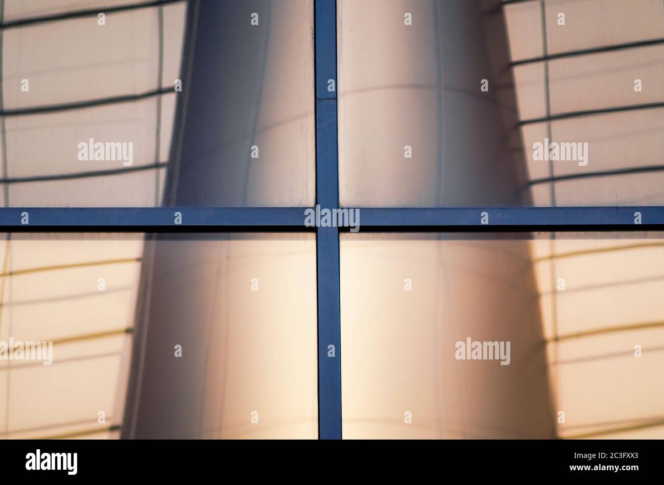 reflection with distortion in the window of a modern building Stock ...