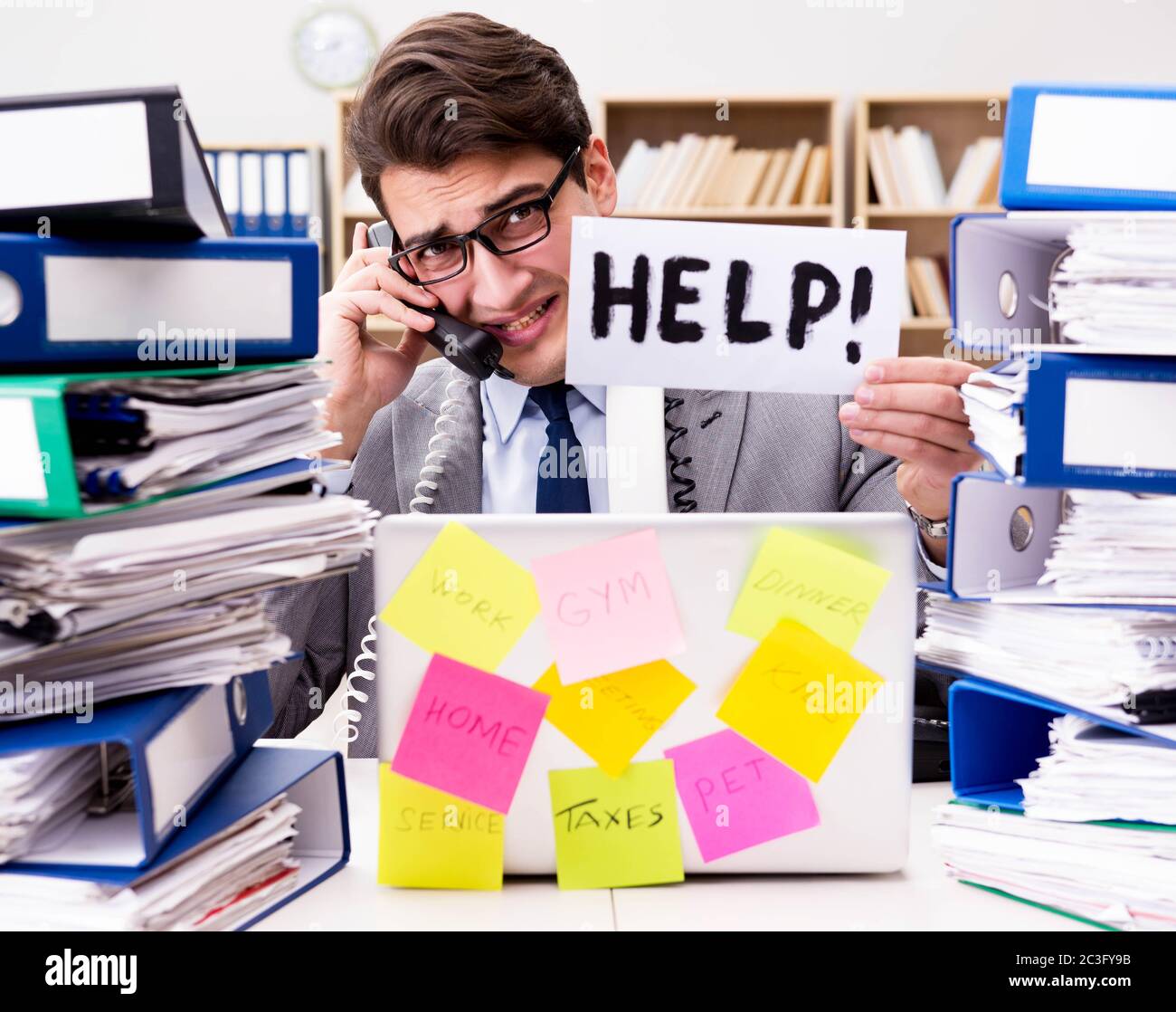 Busy businessman asking for help with work Stock Photo - Alamy