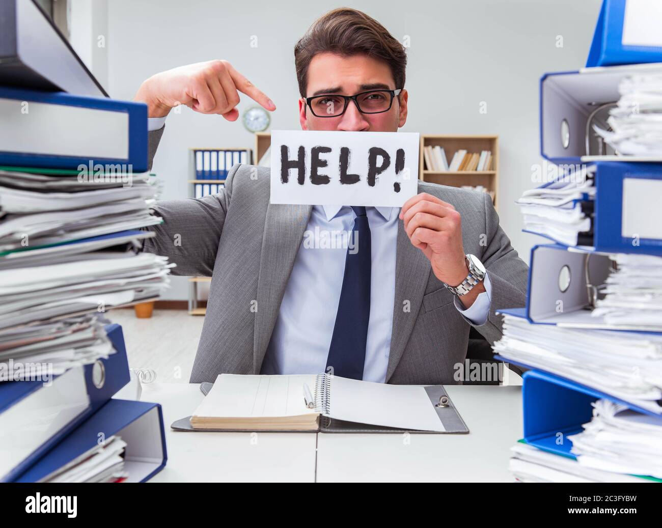 Busy businessman asking for help with work Stock Photo - Alamy