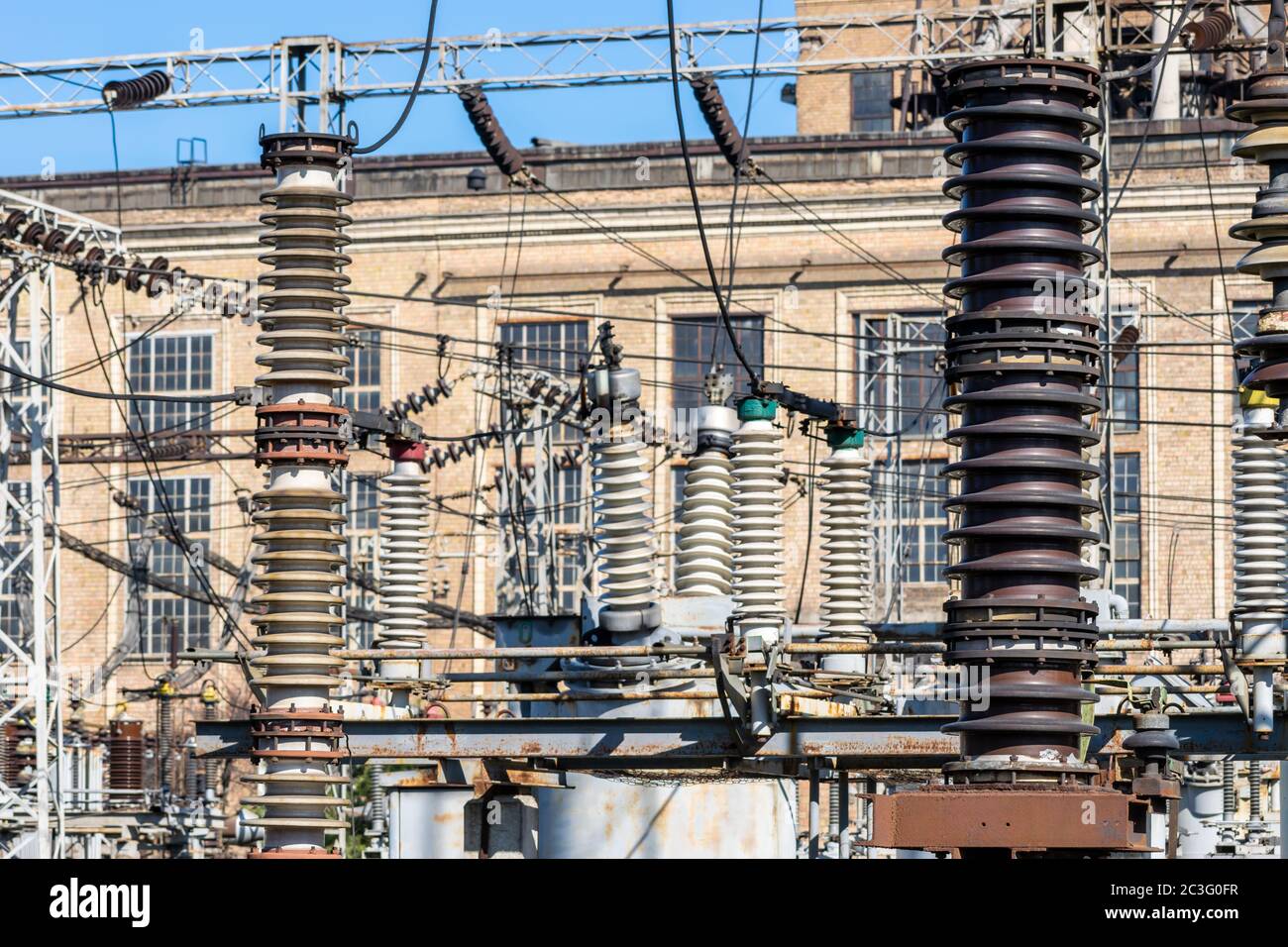 Electric power plant closeup with insulators view Stock Photo - Alamy