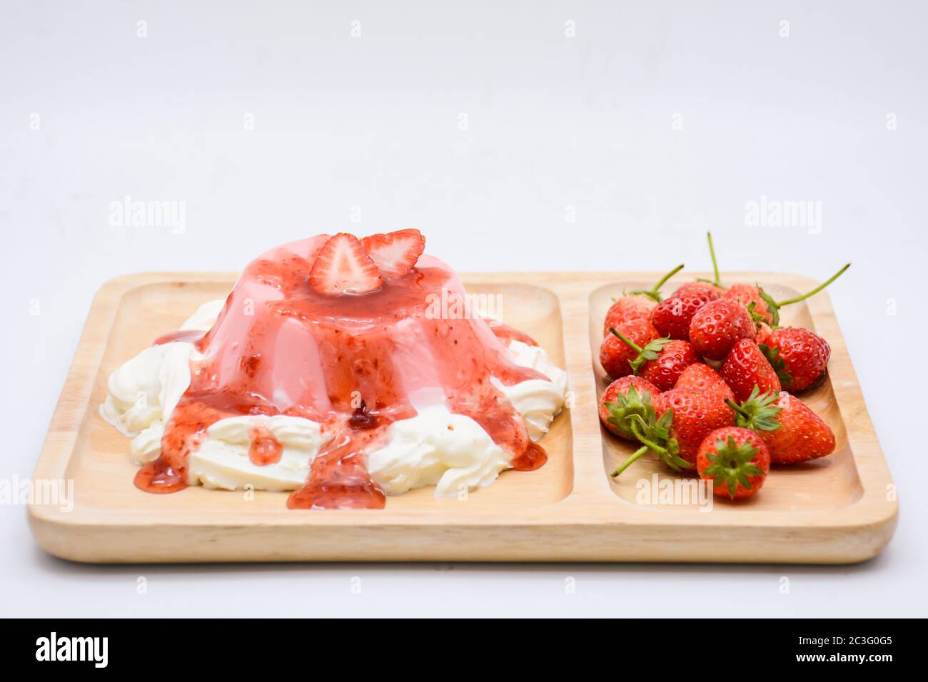 Italian dessert Pana Cotta with strawberries Stock Photo - Alamy