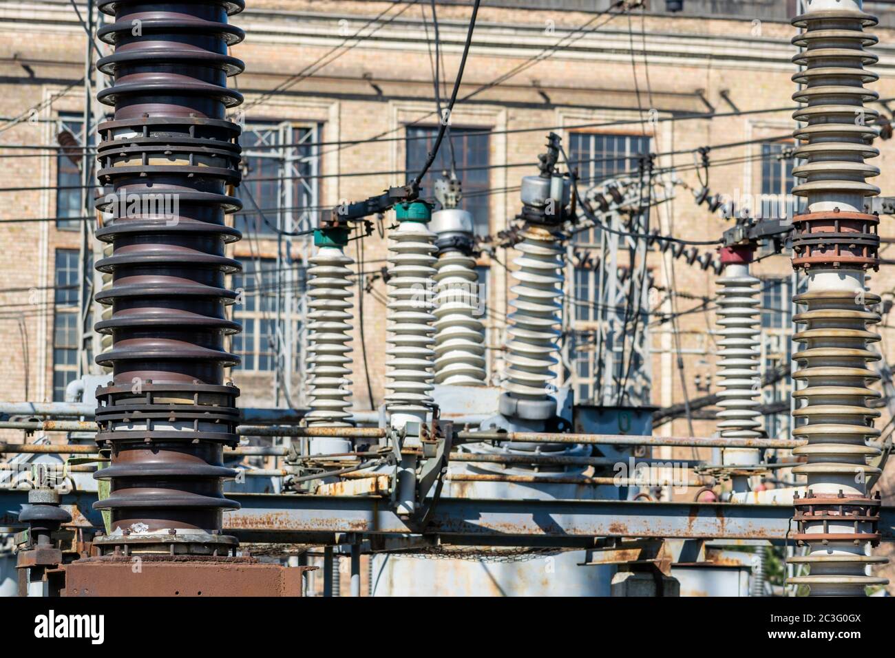 Electric power plant closeup with large insulators view Stock Photo - Alamy