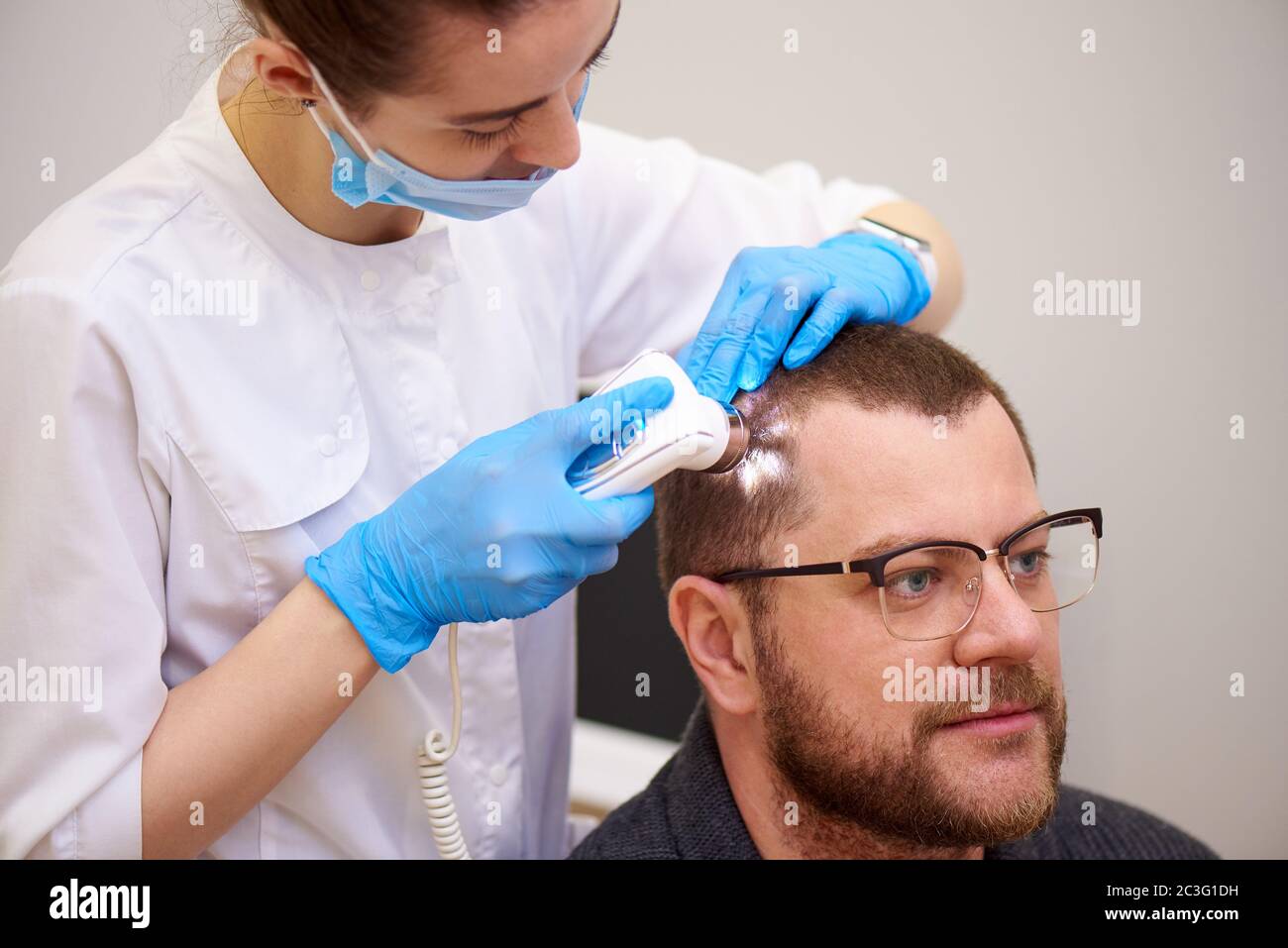 Microscopic examination of the hair and skin of the scalp Stock Photo ...