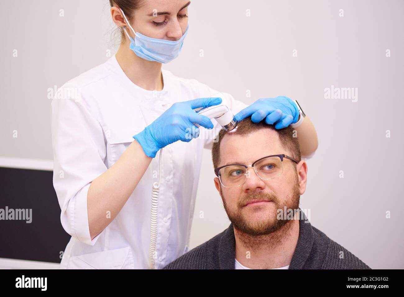 Microscopic examination of the hair and skin of the scalp Stock Photo ...