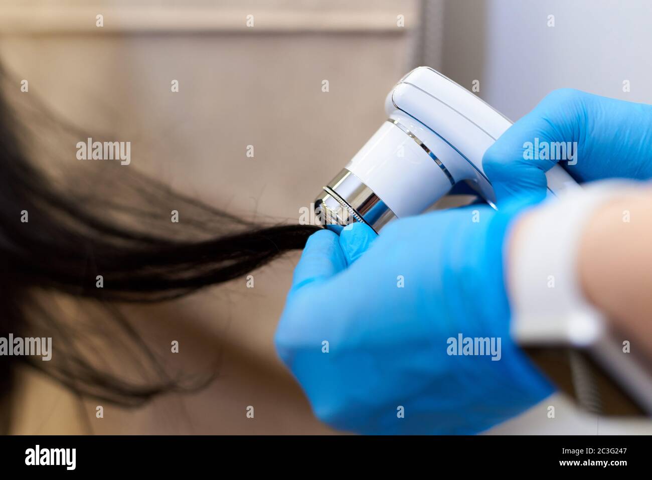Microscopic examination of the hair and skin of the scalp Stock Photo ...