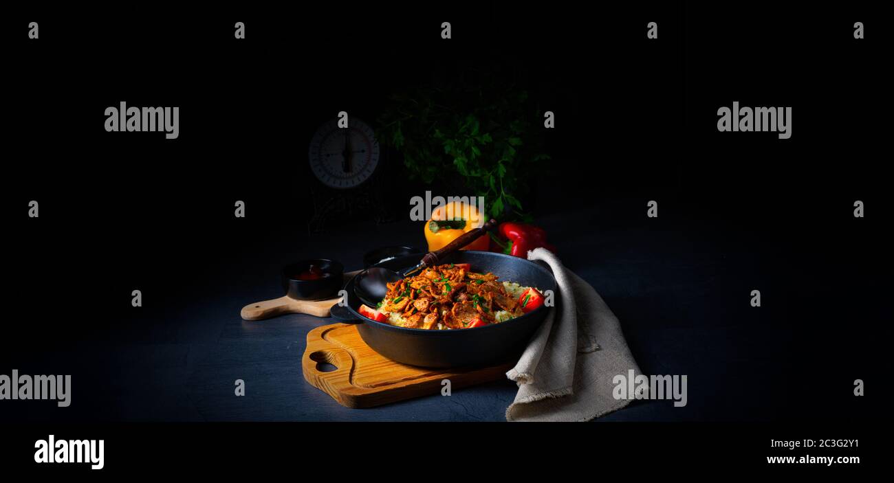 rustic bulgur pans with gratinated gyros and yoghurt Stock Photo - Alamy