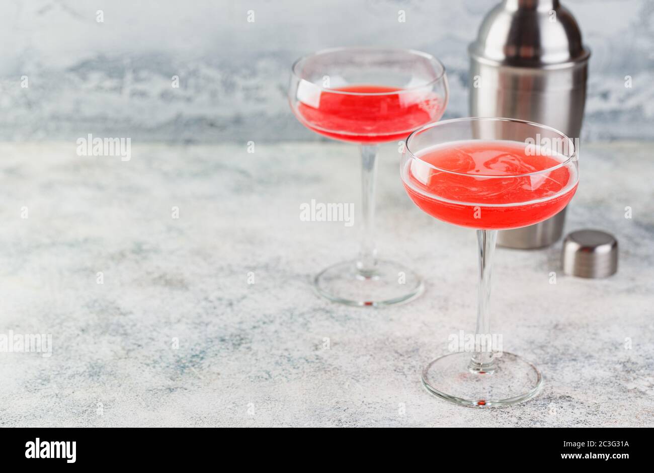 Pink Raspberry Cocktail in drink glass Stock Photo - Alamy