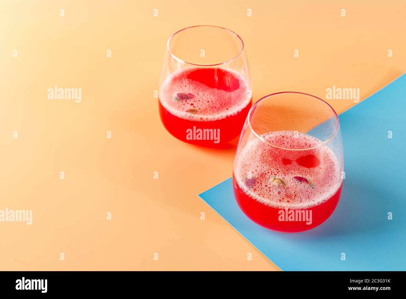 Pink Raspberry Cocktail in drink glass Stock Photo - Alamy