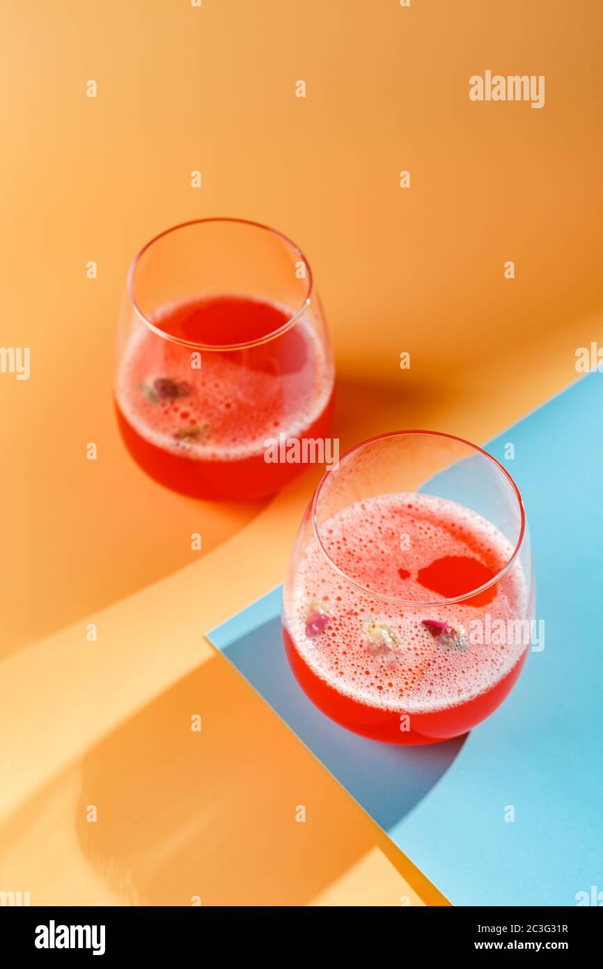 Pink Raspberry Cocktail in drink glass Stock Photo - Alamy
